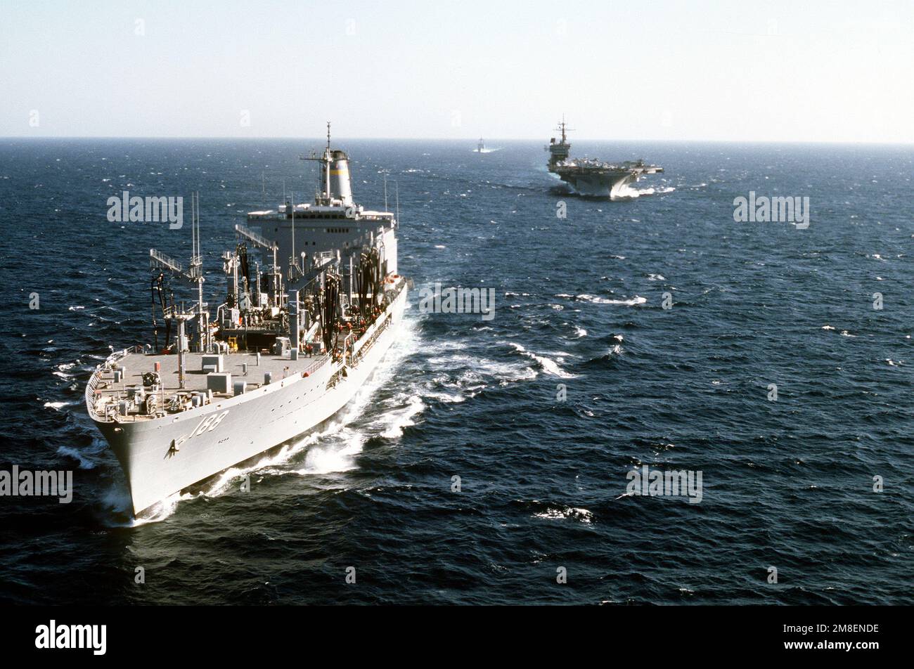 The aircraft carrier USS JOHN F. KENNEDY (CV-67) approaches the oiler ...