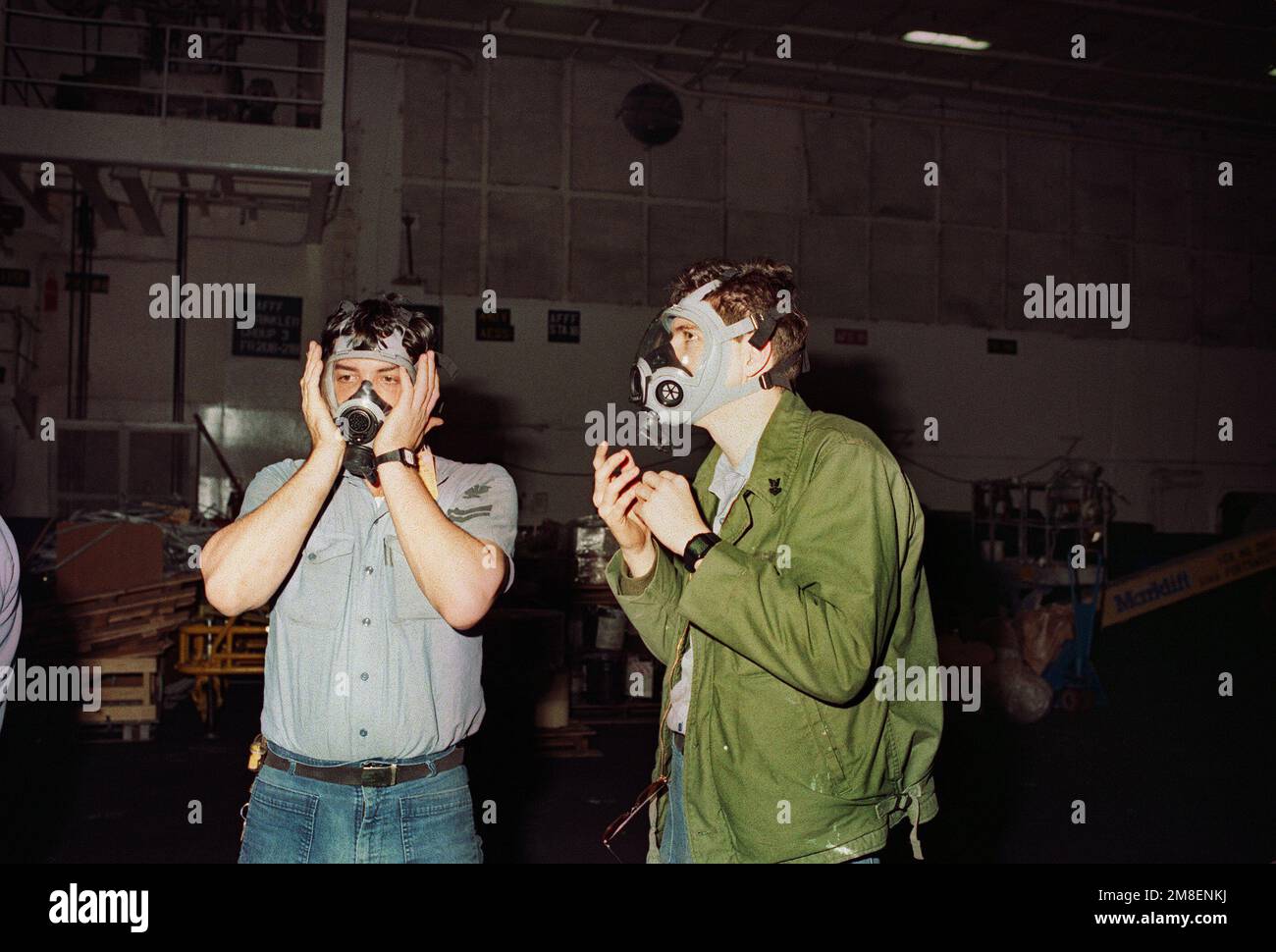 Crew members aboard the nuclear-powered aircraft carrier USS DWIGHT D ...