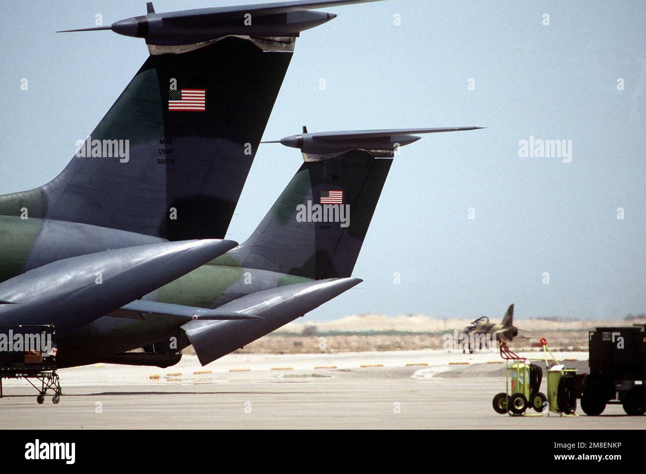 Military Airlift Command C-141B Starlifter aircraft stand on the runway ...