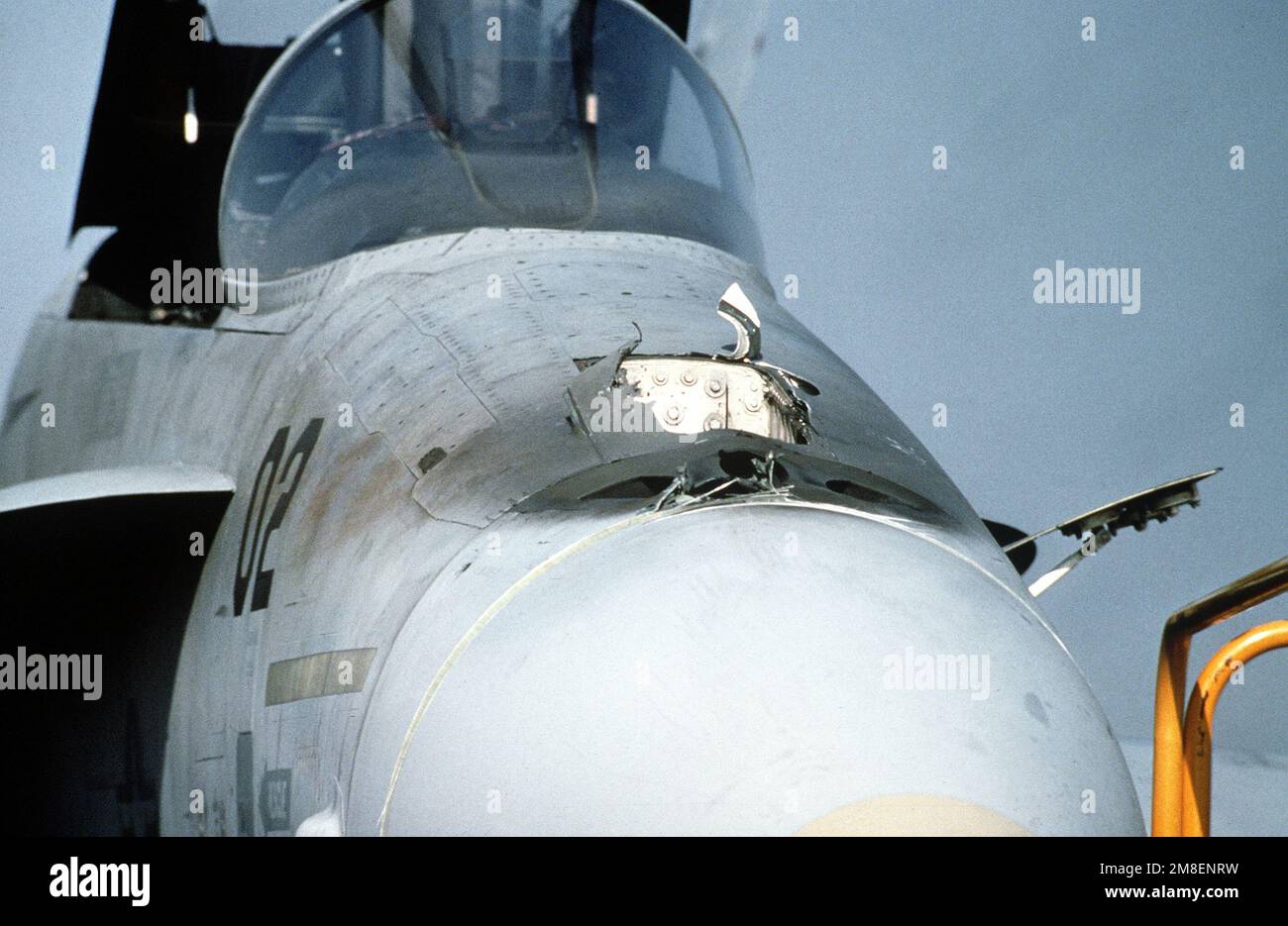 A view of the damage to the fuselage of an F/A-18 strike fighter ...