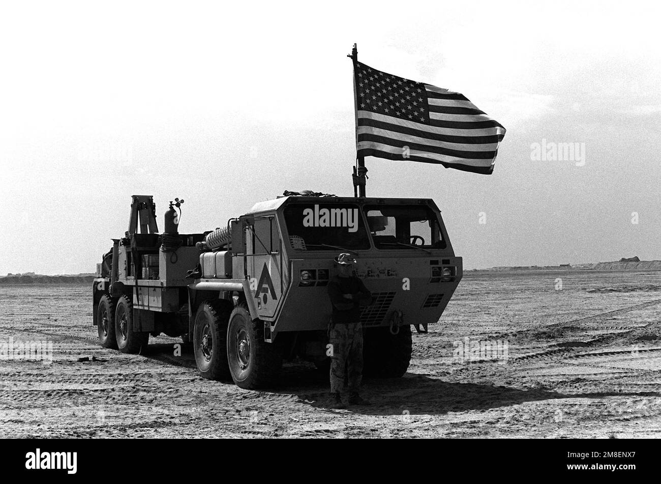 CPL. D. D. Smith flies the American flag from atop an M-48 Oshkosh ...