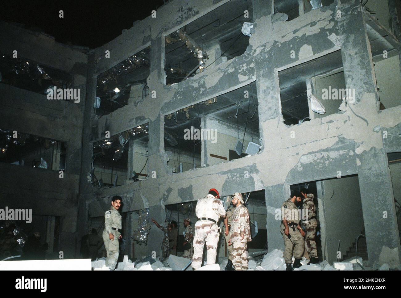 Saudi and U.S. Army personnel sift through the remains of an elementary ...