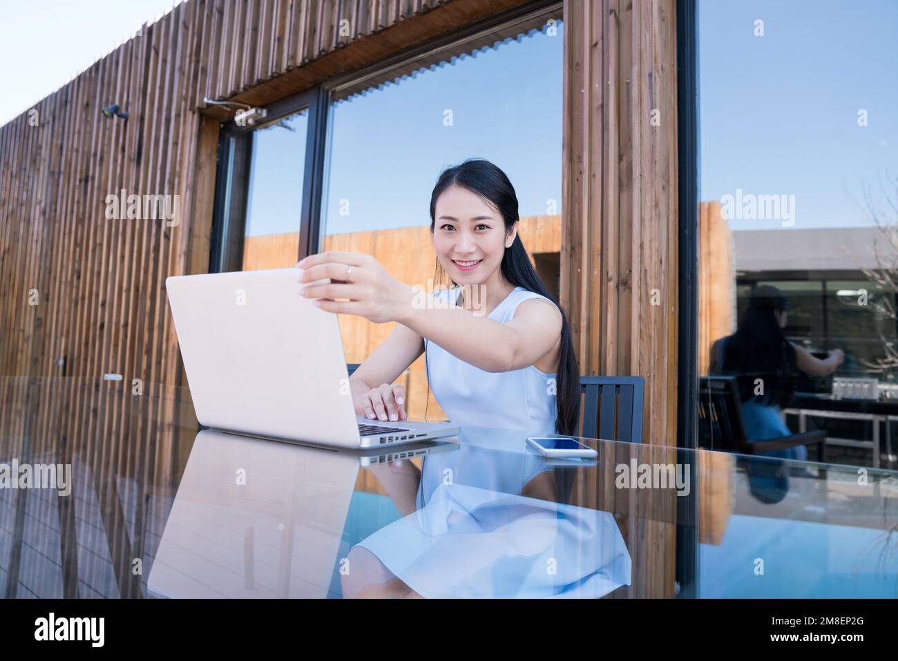 A young woman use the computer Stock Photo - Alamy