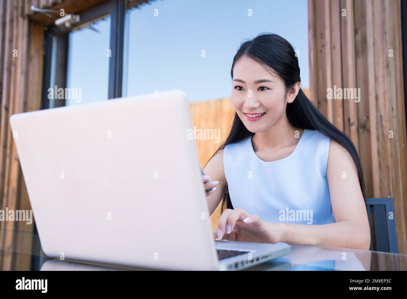 A young woman use the computer Stock Photo - Alamy