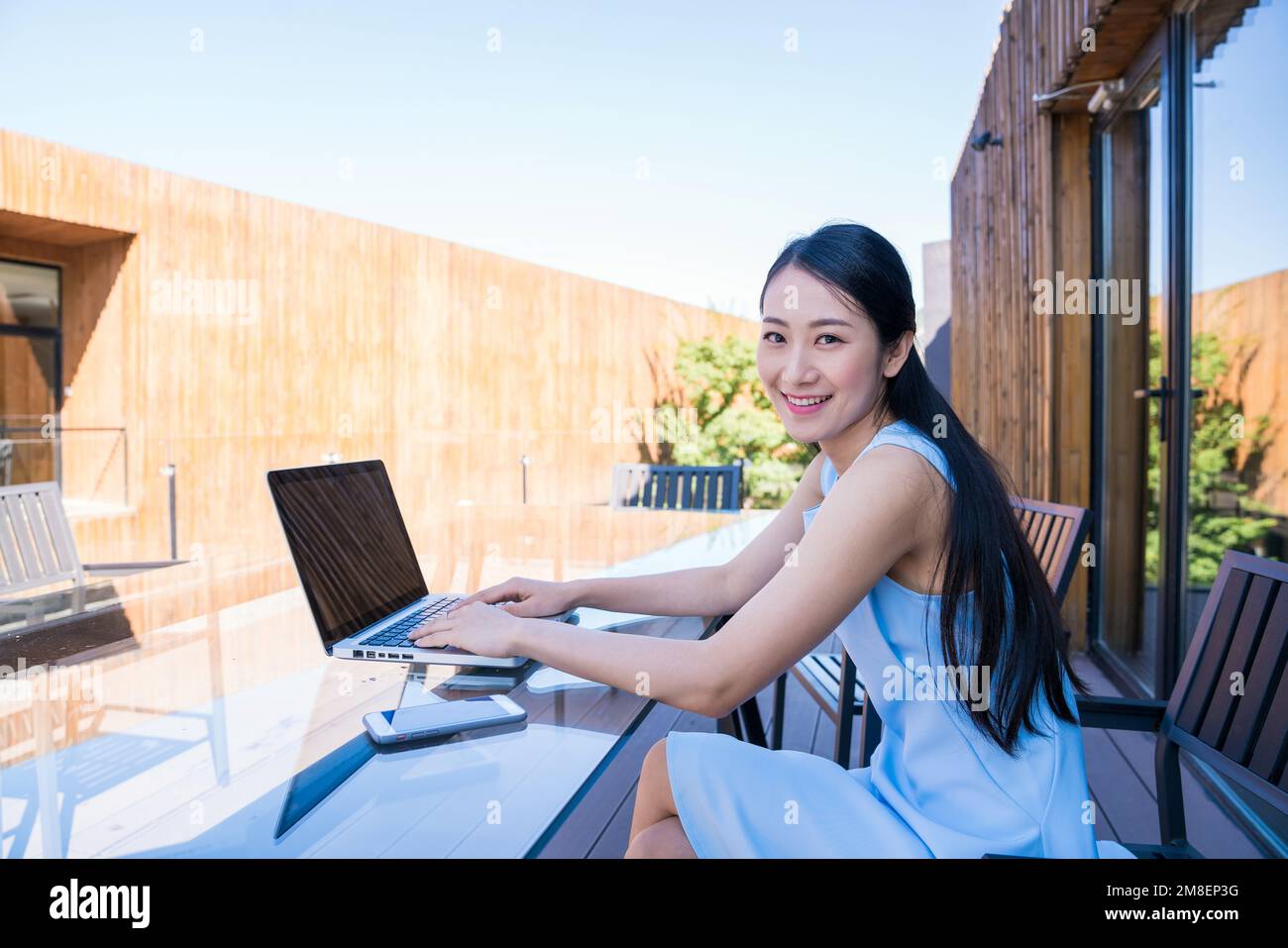 A young woman use the computer Stock Photo - Alamy