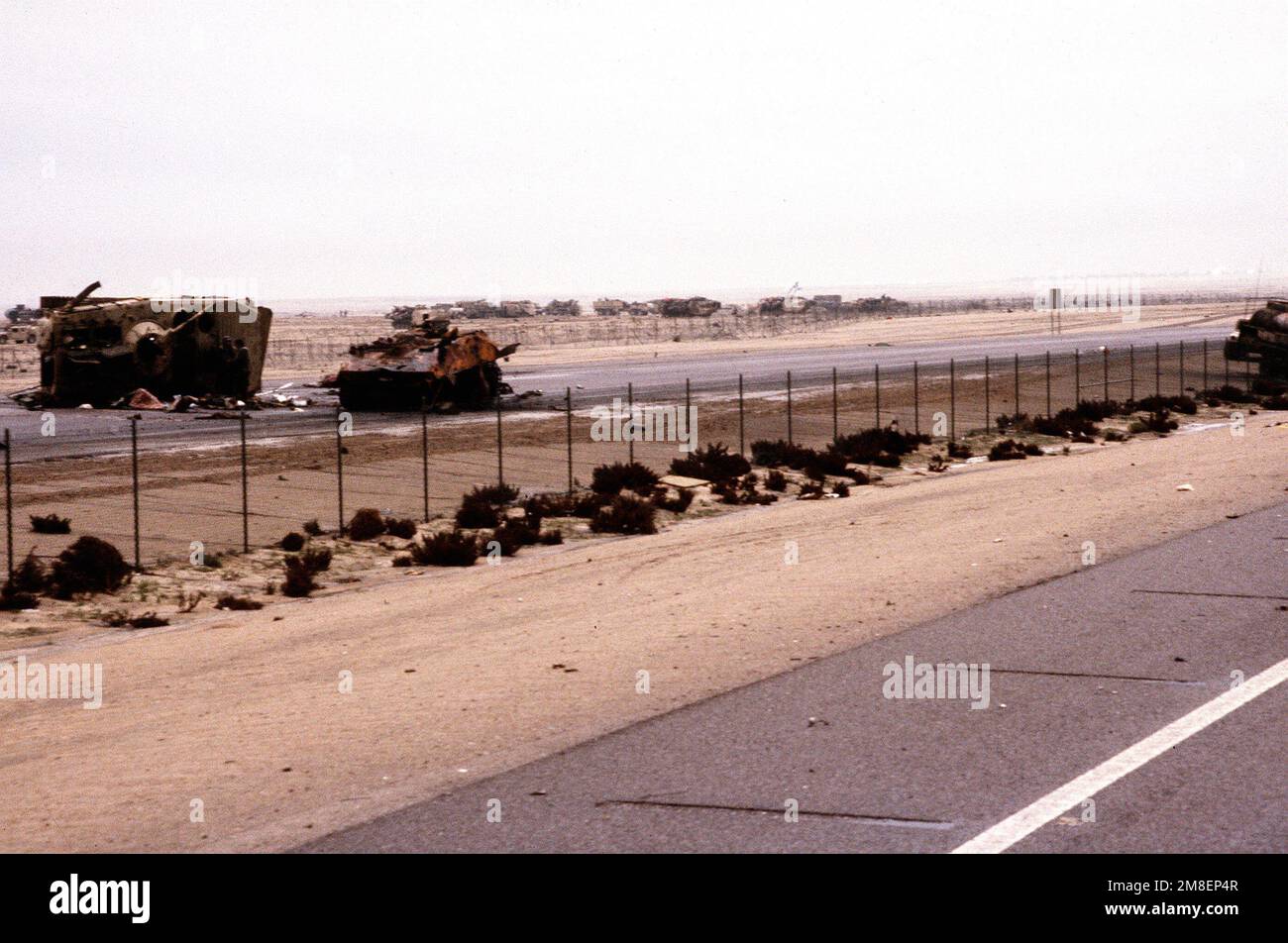 A destroyed Iraqi BMP-1 mechanized infantry combat vehicle, left, lies ...
