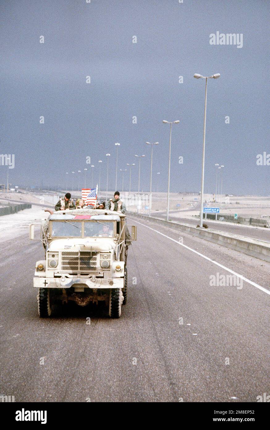Marines from the 2nd Marine Expeditionary Force ride in the back of an ...