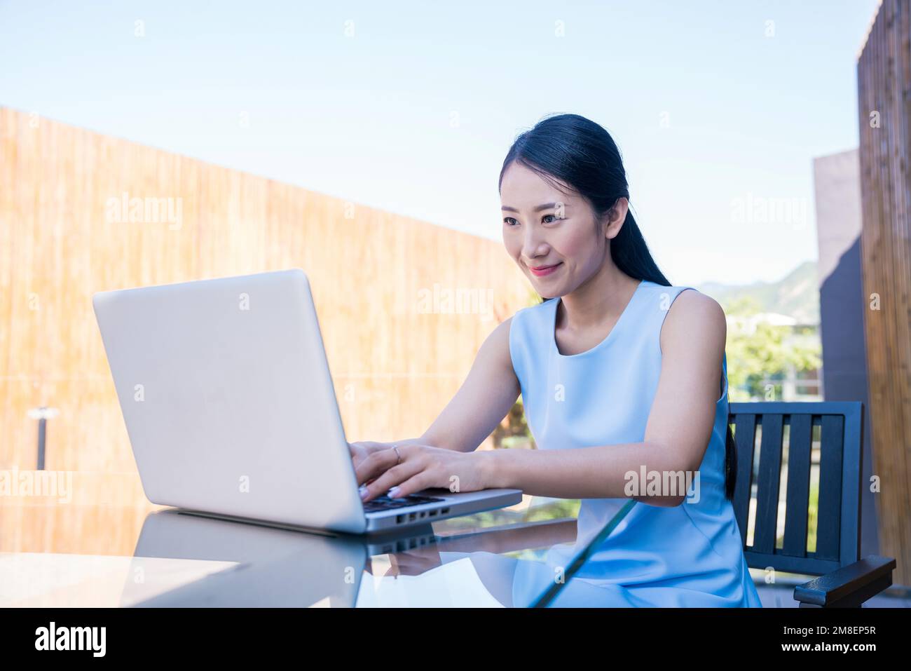 A young woman use the computer Stock Photo - Alamy