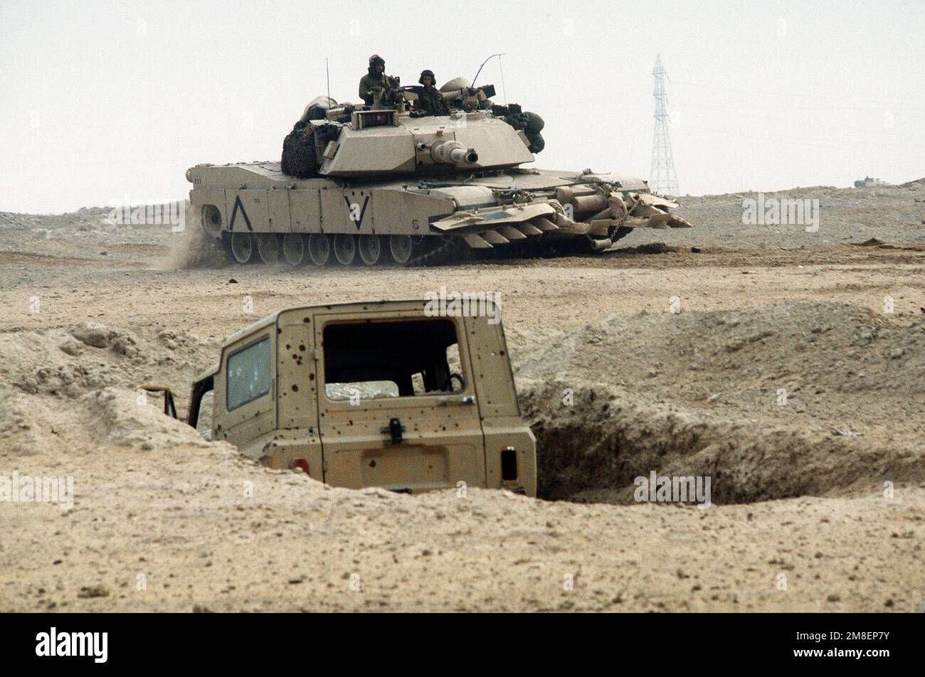 A Marine Corps M-1A1 Abrams main battle tank equipped with a mine ...