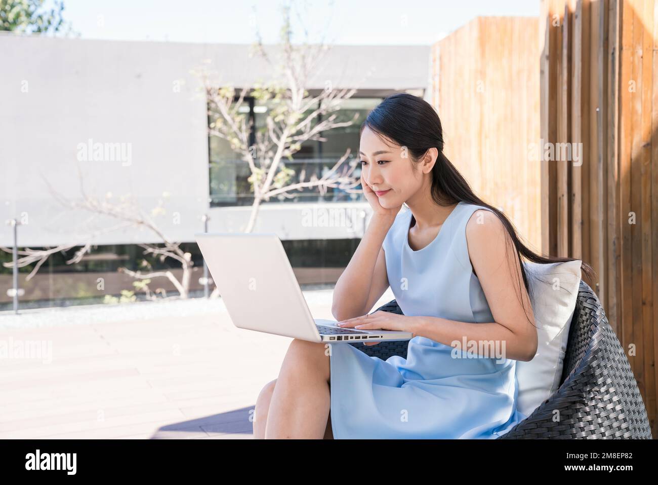 A young woman use the computer Stock Photo - Alamy