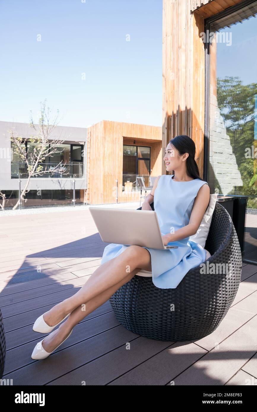 A young woman use the computer Stock Photo - Alamy