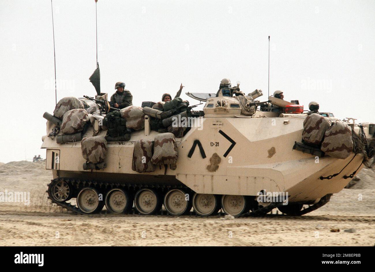 A Marine Corps AAVP-7A1 amphibious assault vehicle moves through an ...
