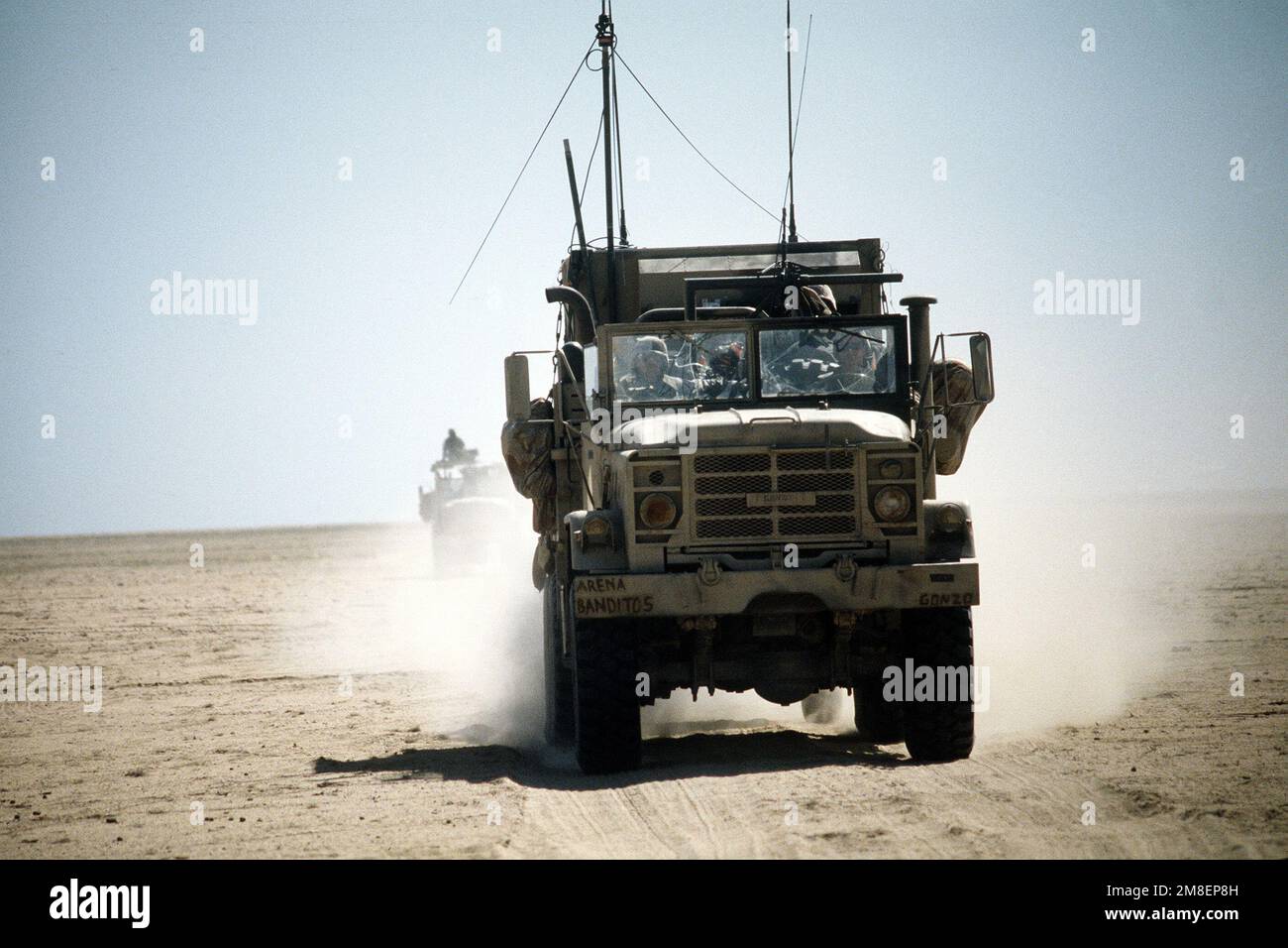 A Marine Corps M-939 5-ton cargo truck carrying communications ...