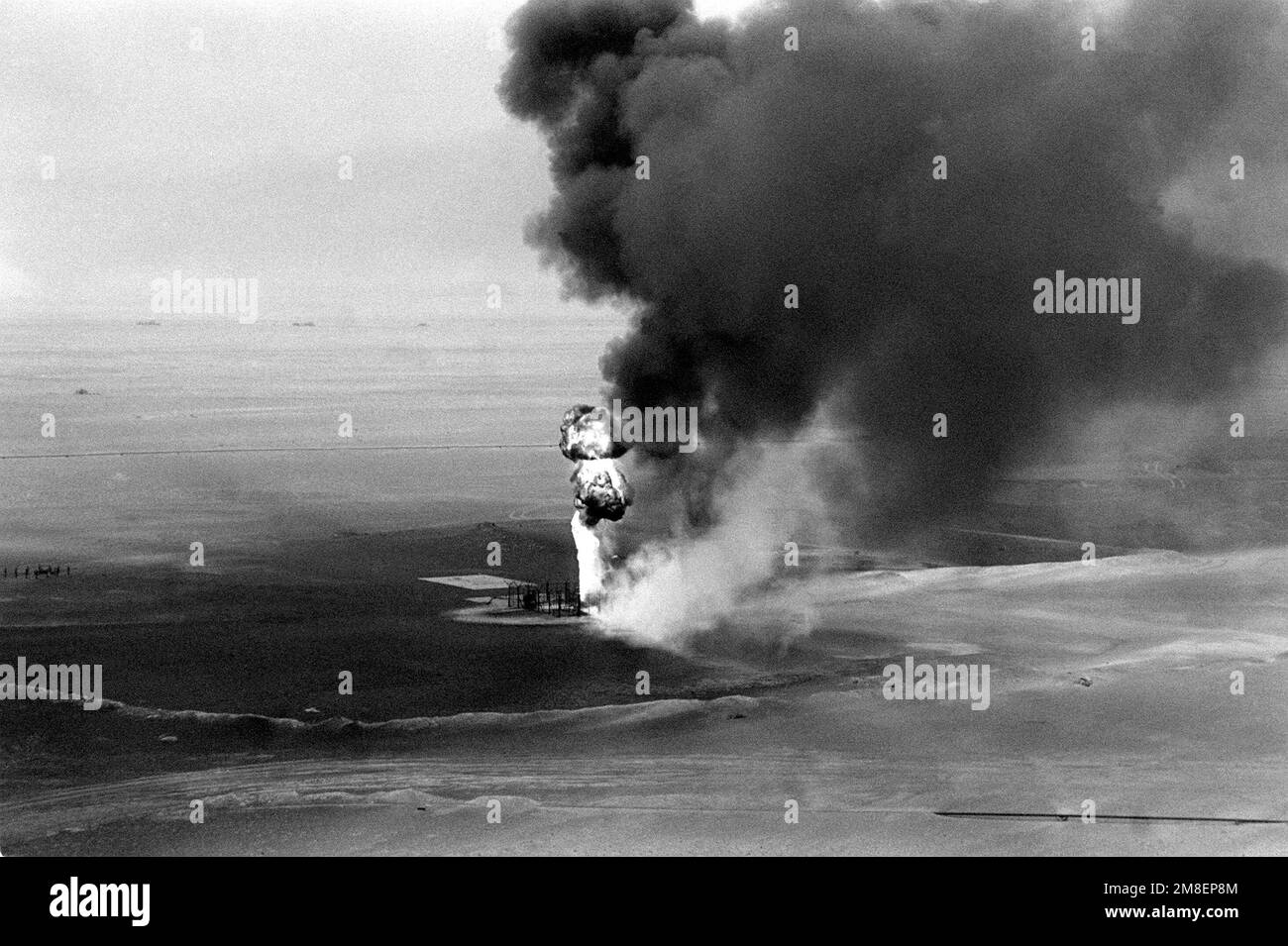 One of many oil wells set aflame by Iraqi forces burns out of control ...