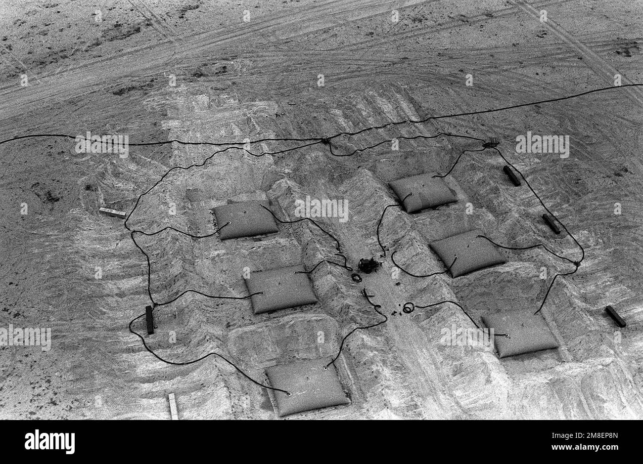 An aerial view of collapsible fuel storage reservoirs in a fuel storage ...