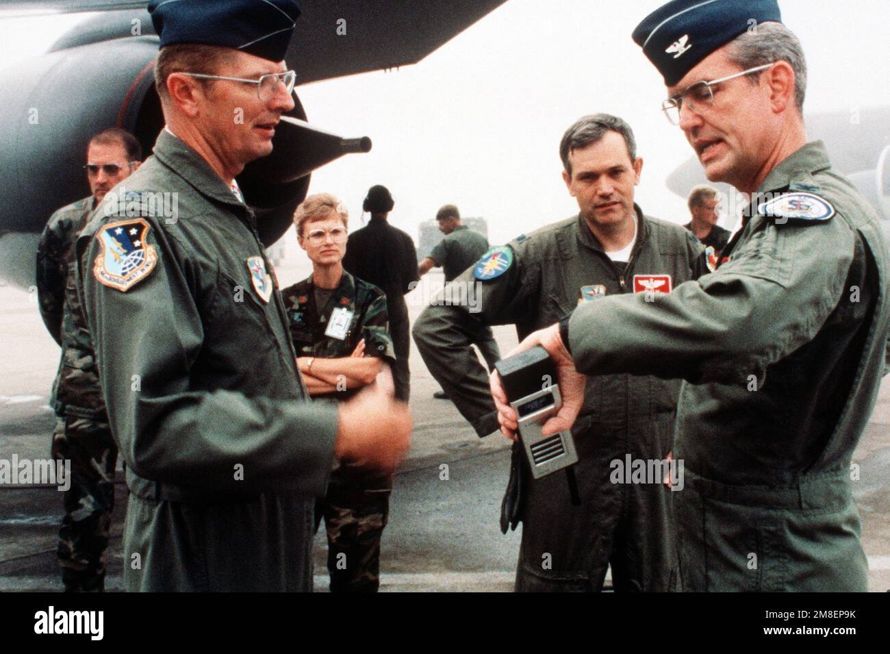 COL. Marc L. Drinkhahn, 416th Bombardment Wing, converse with military ...