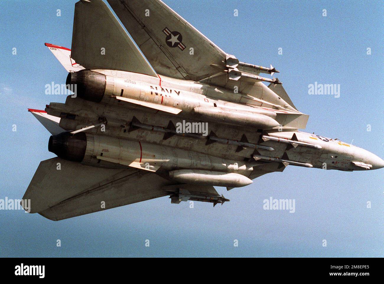 An underside view of a Fighter Squadron 41 (VF-41) F-14A Tomcat aircraft on a combat air patrol ...