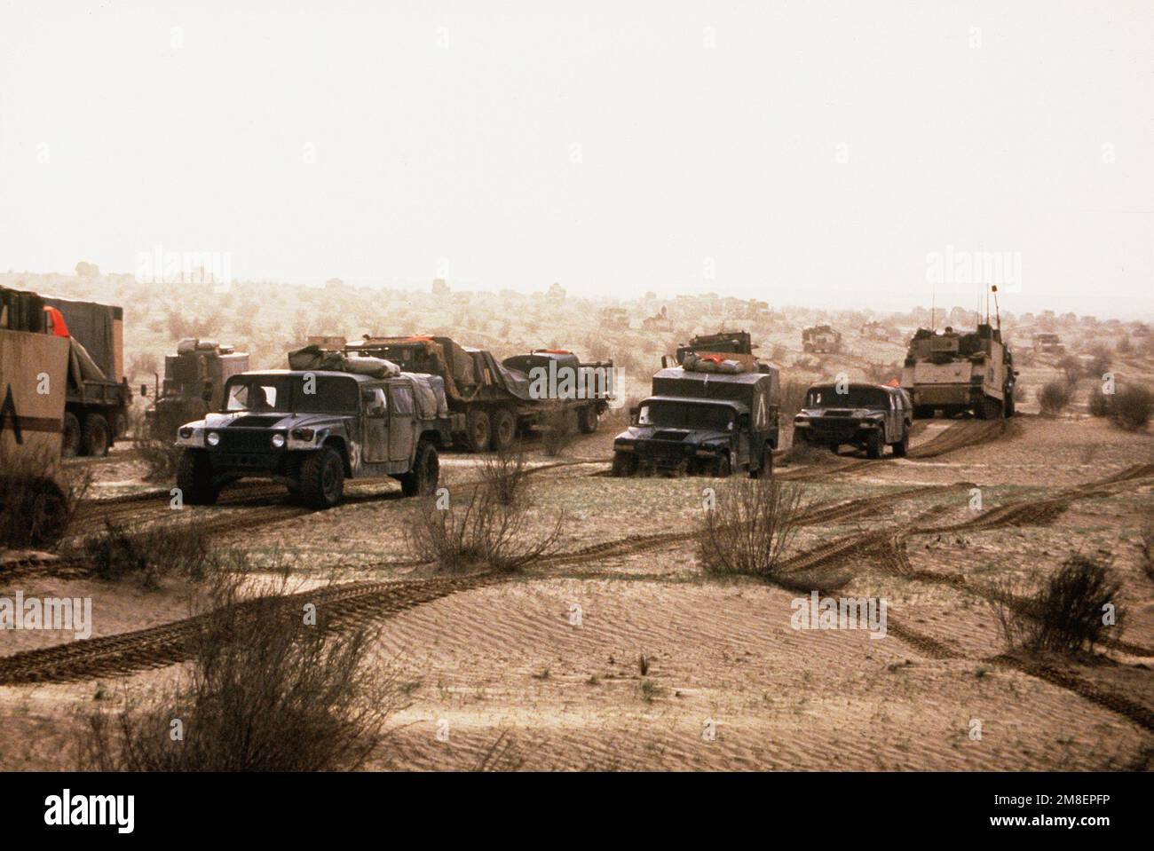 M998 High-Mobility Multipurpose Wheeled Vehicles (HMMWV), an M-577 ...