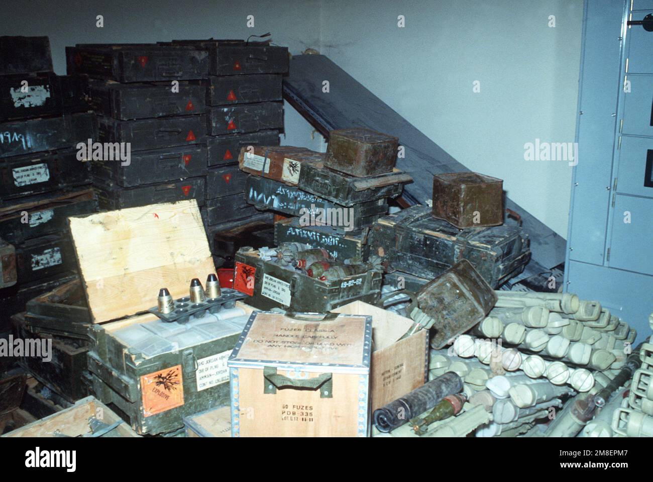 Boxes of Iraqi ammunition are stacked in the royal palace after the ...