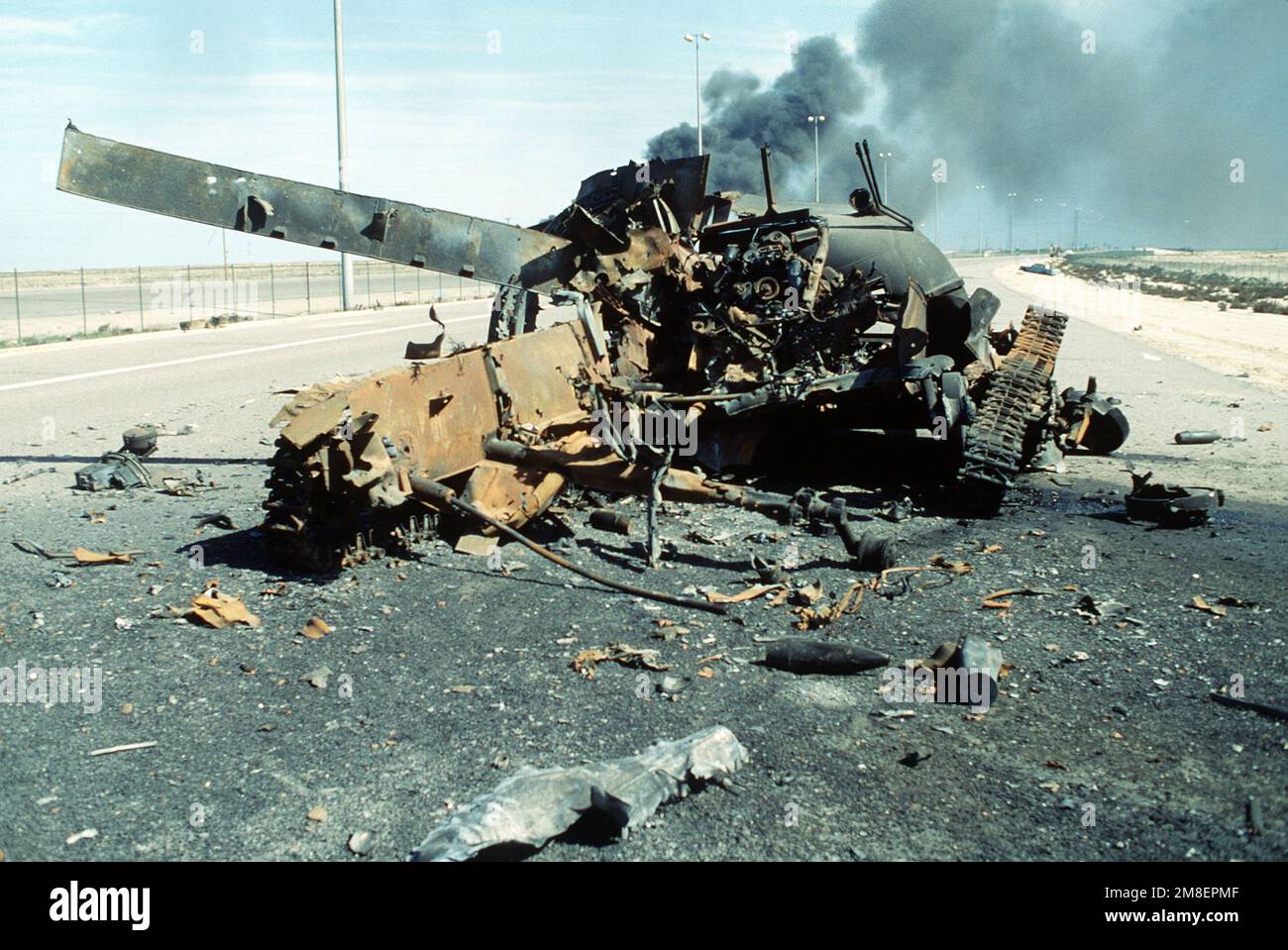 An Iraqi main battle tank on a highway south of Kuwait City destroyed ...