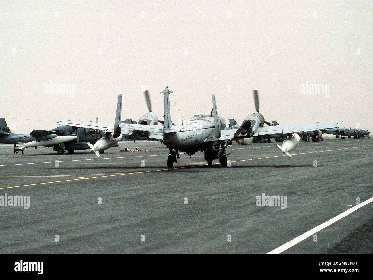 An OV-1D Mohawk surveillance aircraft taxis for takeoff on a mission in ...