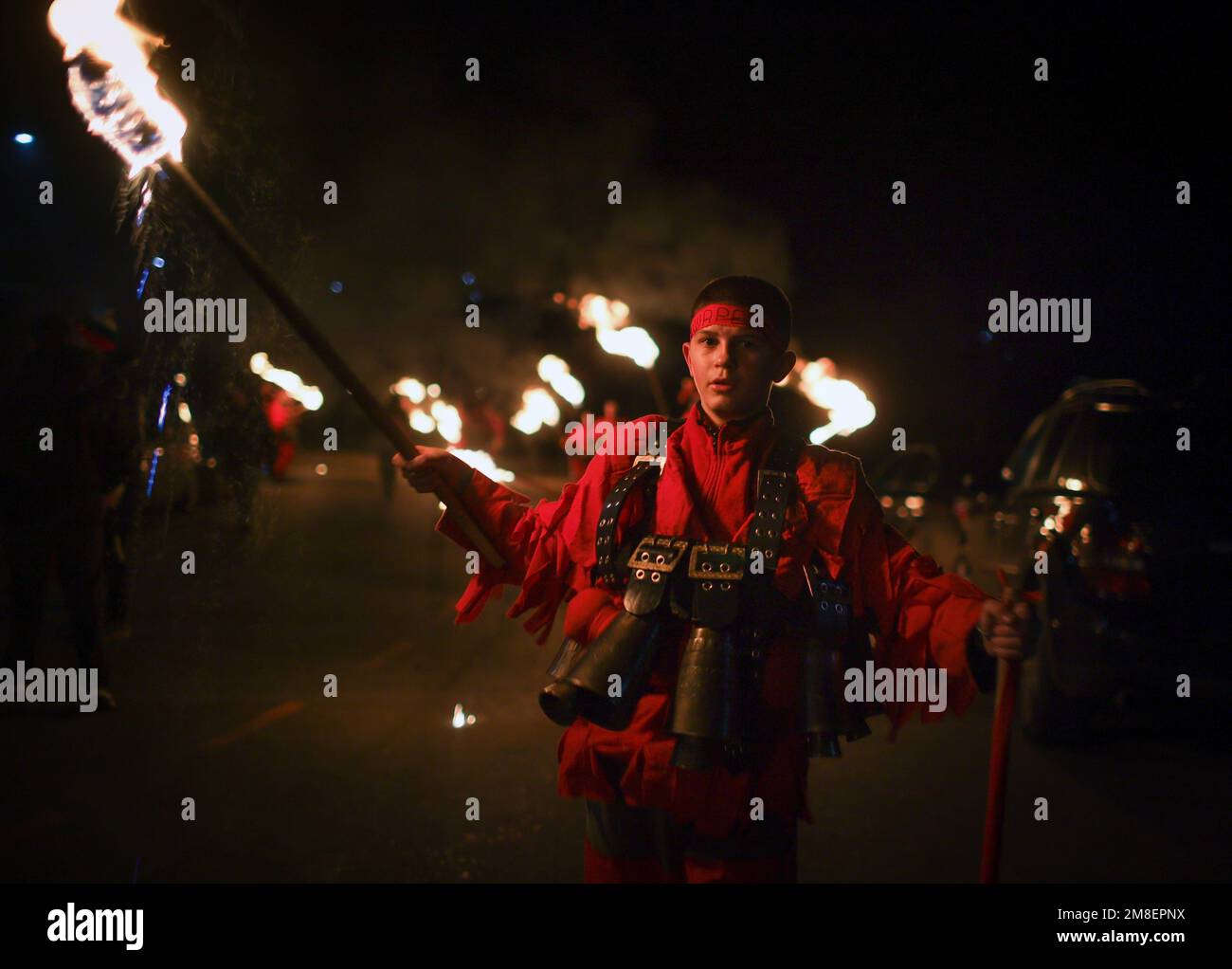 Dancers hold their torches as they perform an age-old ritual chasing ...