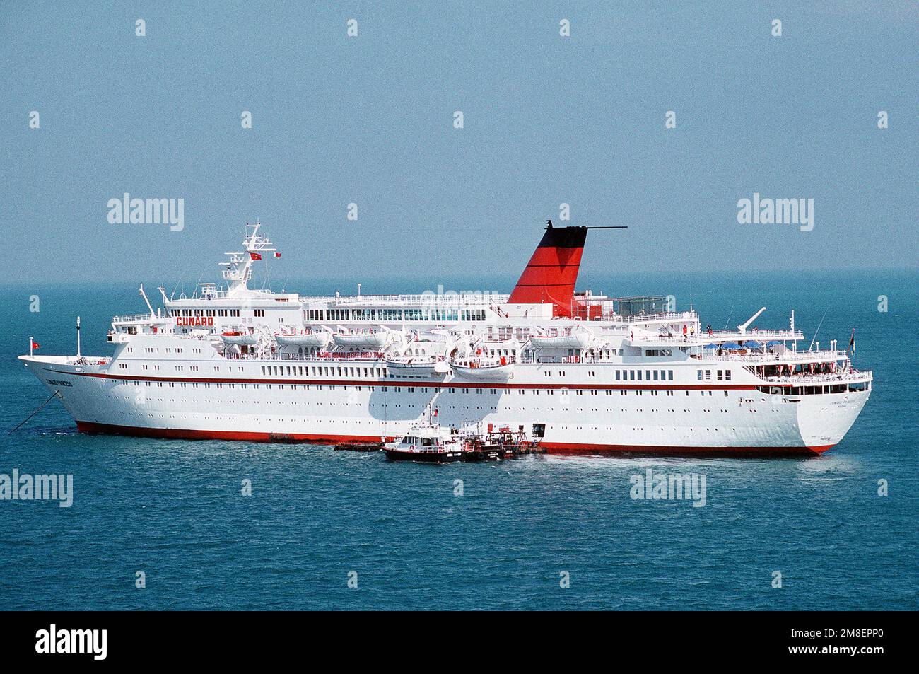 Small boats come alongside the cruise ship RMS Cunard Princess ...