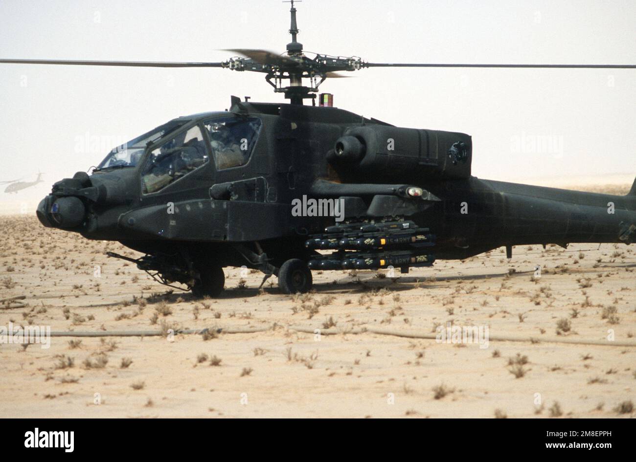 An AH-64A Apache anti-tank helicopter of the XVIII Airborne Corps ...
