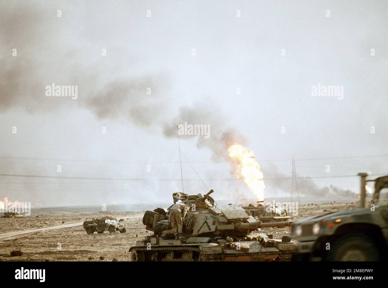 Two U.S. Marine Corps M-60A1 Main Battle Tanks (MBT), an M88 armored ...
