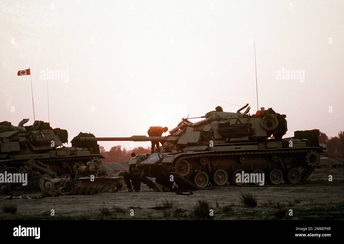 U.S. Marine tank crewmen perform maintenance on their M-60A1 main ...