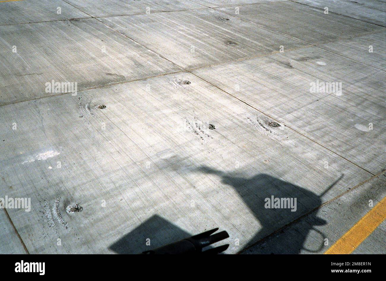 A view of part of a runway damaged during Operation Desert Storm. The ...