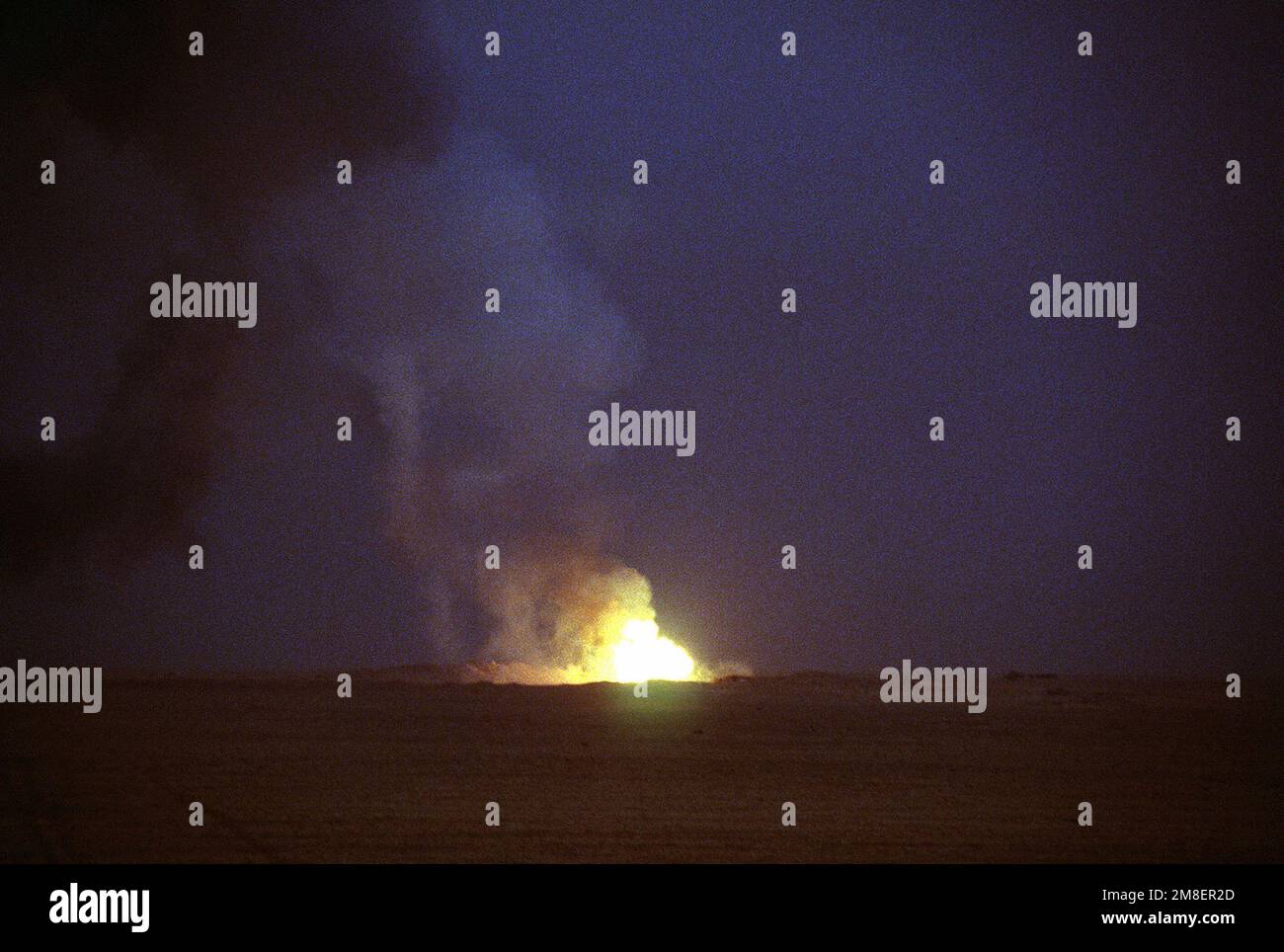 The desert lights up with burning Iraqi tanks after an attack by the ...