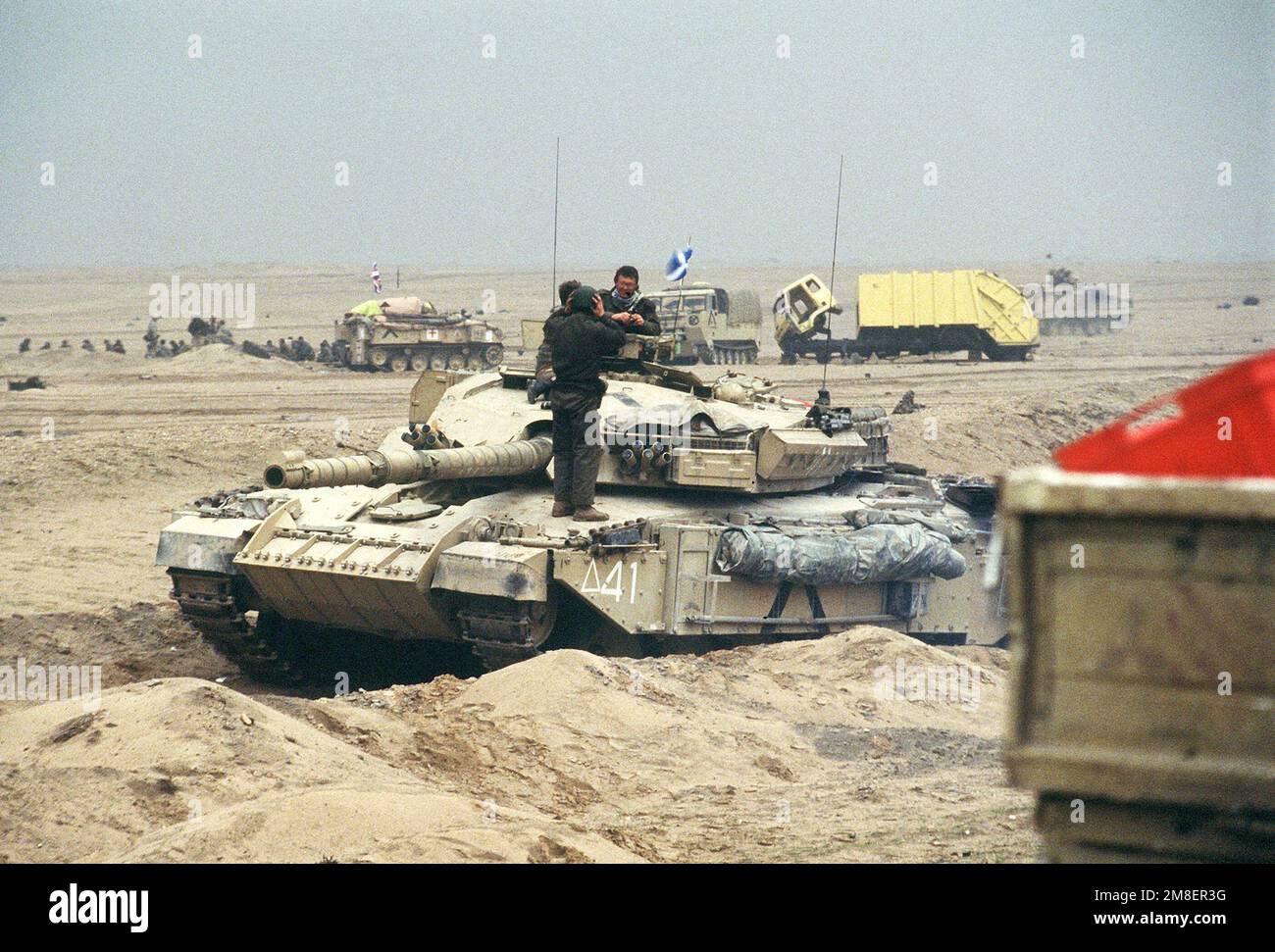 A British Challenger main battle tank waits by the Basra-Kuwait Highway ...
