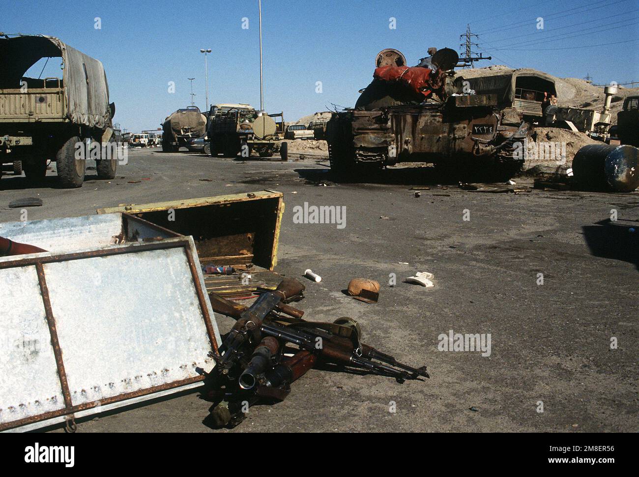 Military vehicles clog the road leading out of Kuwait City after the ...