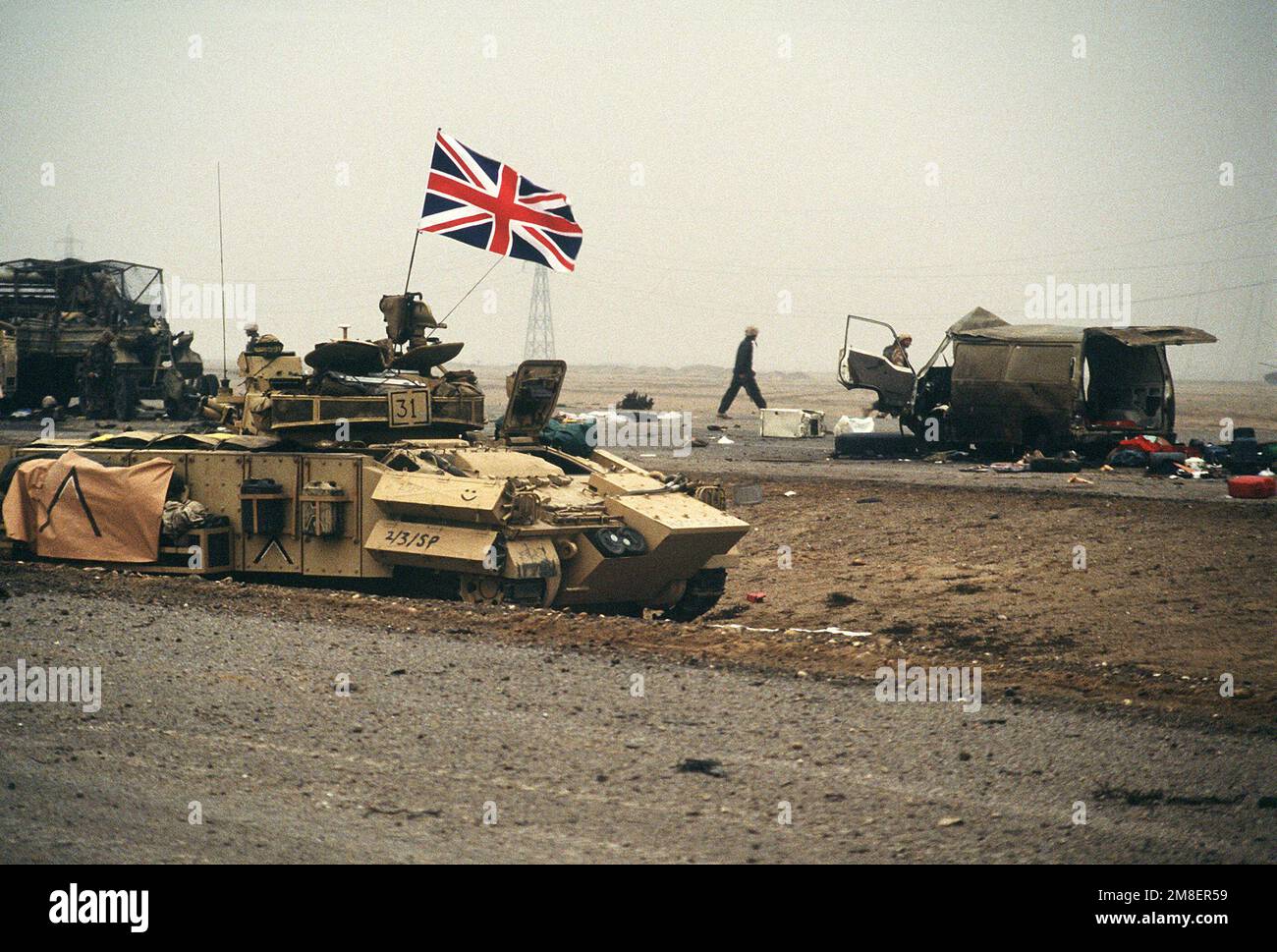 The British flag waves from an armored personnel carrier of the 7th ...