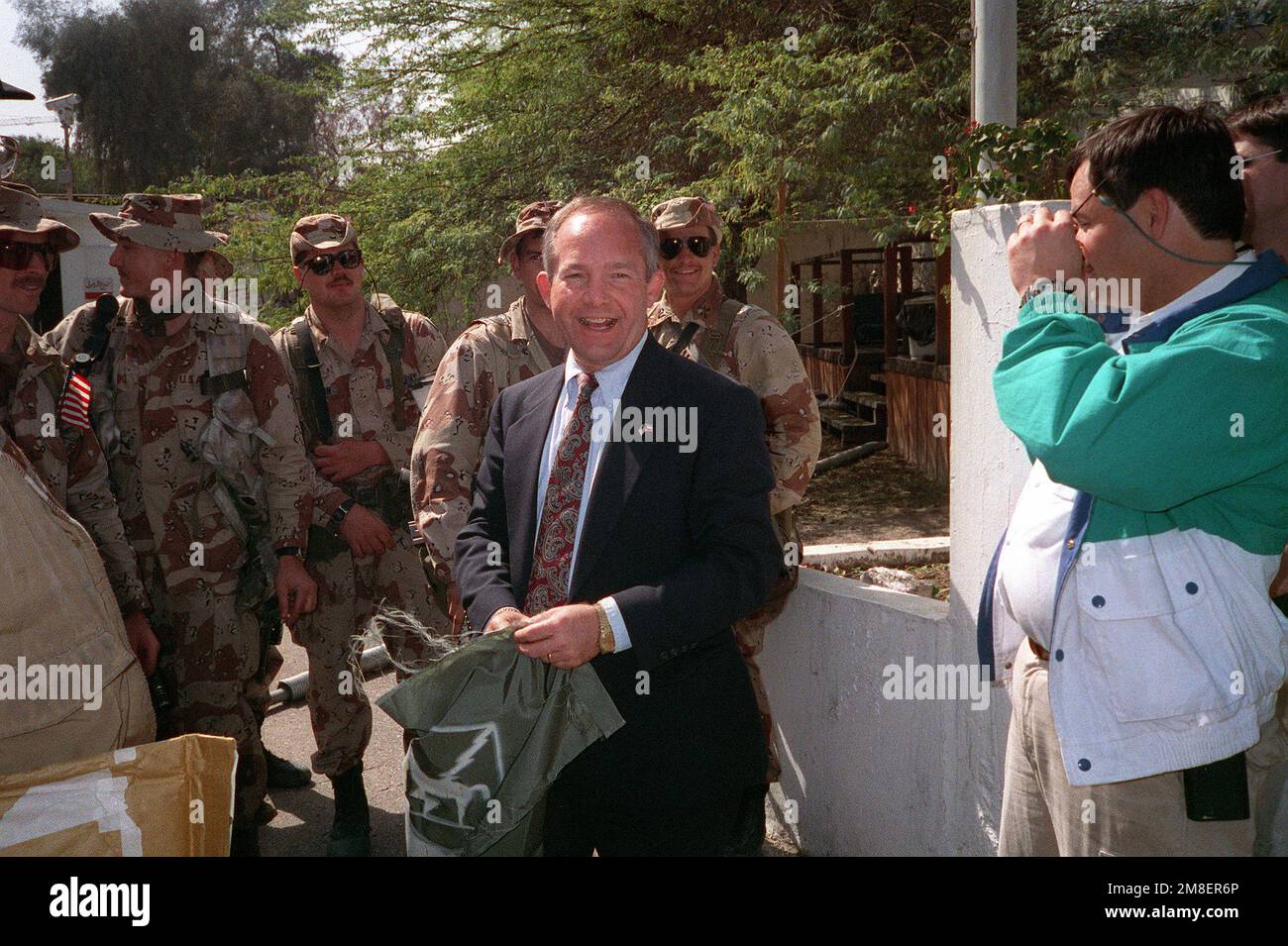 Edward Gnehm, center, U.S. ambassador to Kuwait, speaks to soldiers and ...