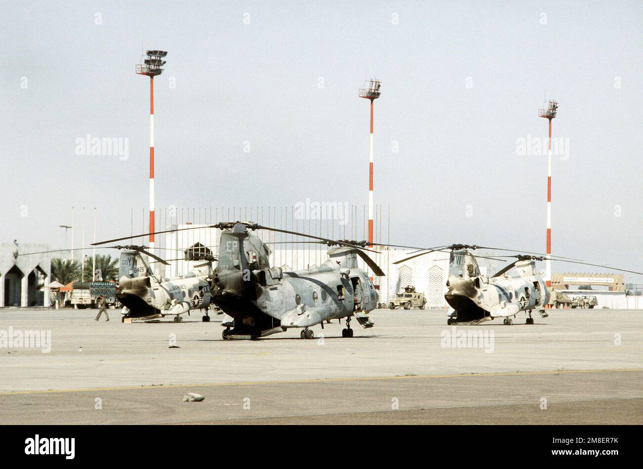 Three US Marine CH-46 Sea Knights stand flight ready at Kuwait ...