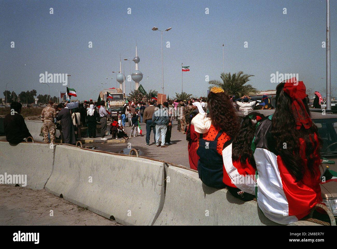 Civilians and coalition military forces fill the streets as they ...