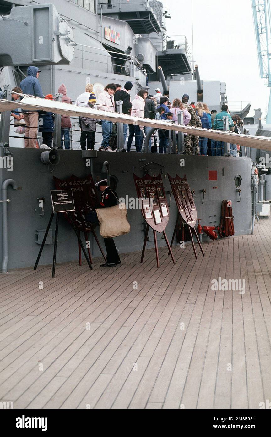 Guests form a line on a deck of the battleship USS WISCONSIN (BB-64 ...
