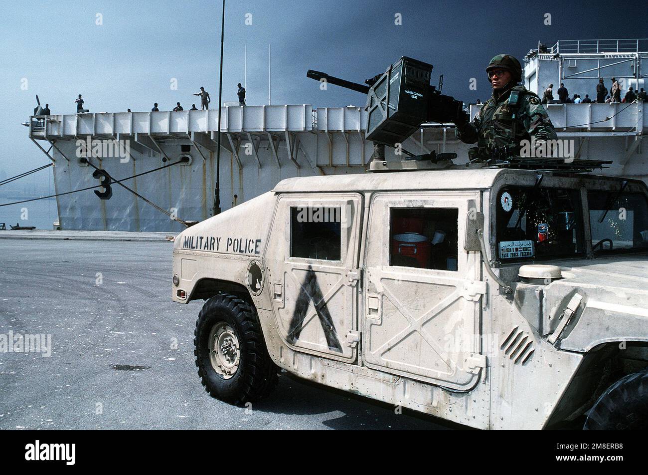 An Army military policeman mans the Mark 19 automatic grenade launcher ...
