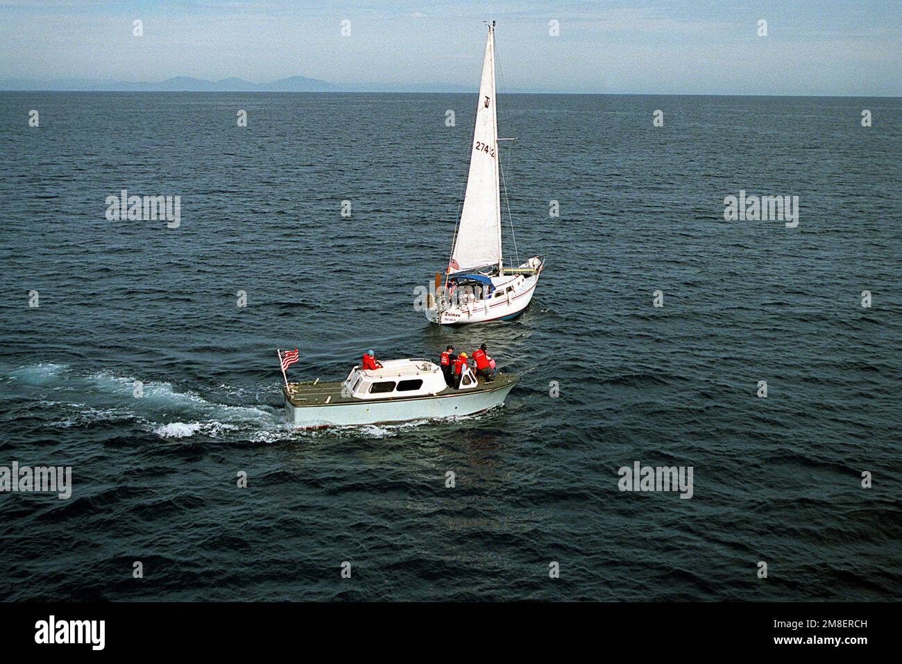 Sailors aboard a 26-foot personnel boat from the guided missile ...