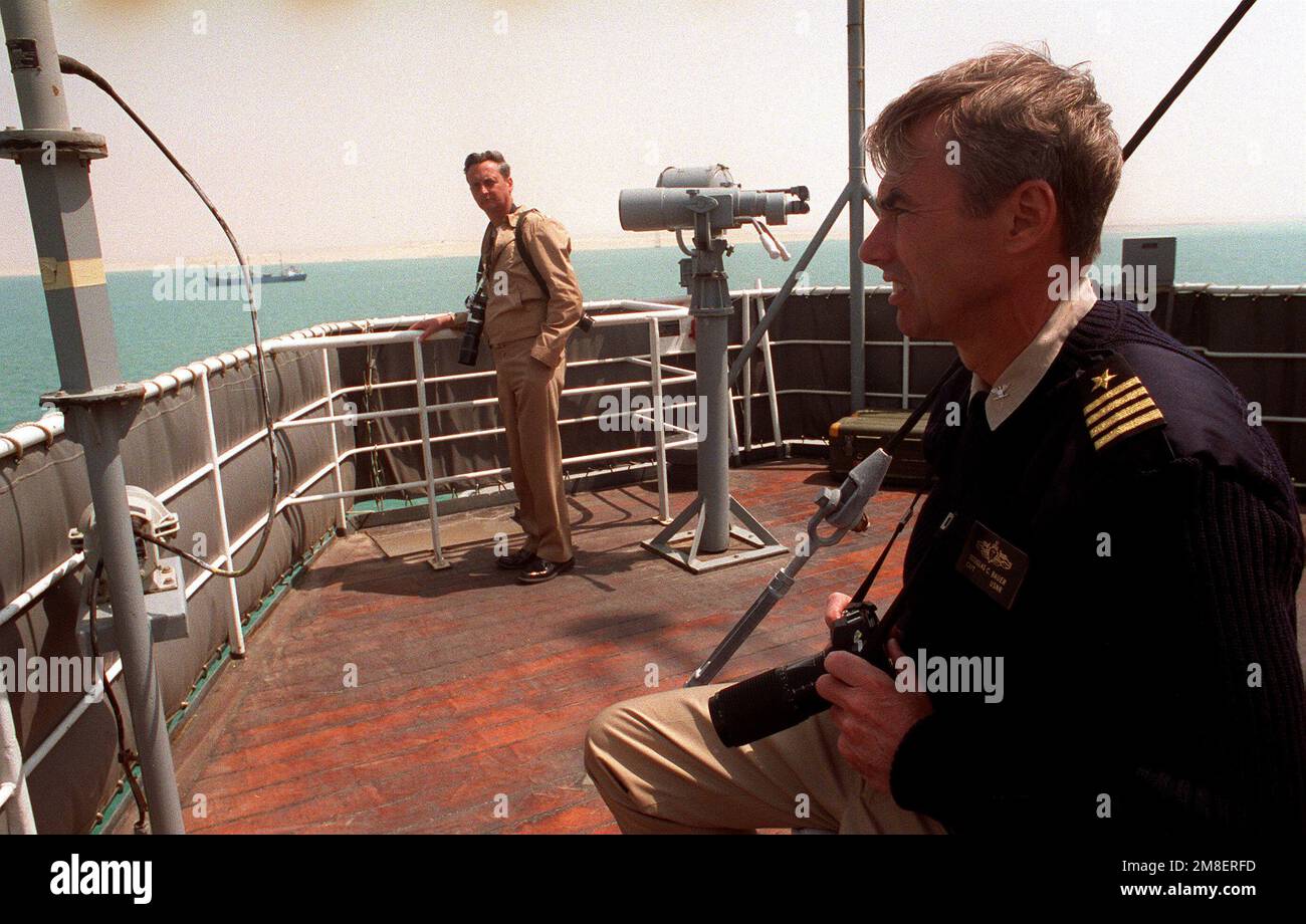 CAPT. Douglas C. Bauer, foreground, a U.S. Navy historian, and CMDR ...