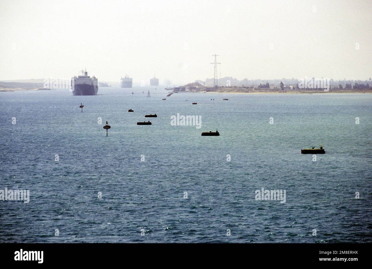 Merchant ships transit the Suez Canal. Country: Egypt (EGY Stock Photo ...