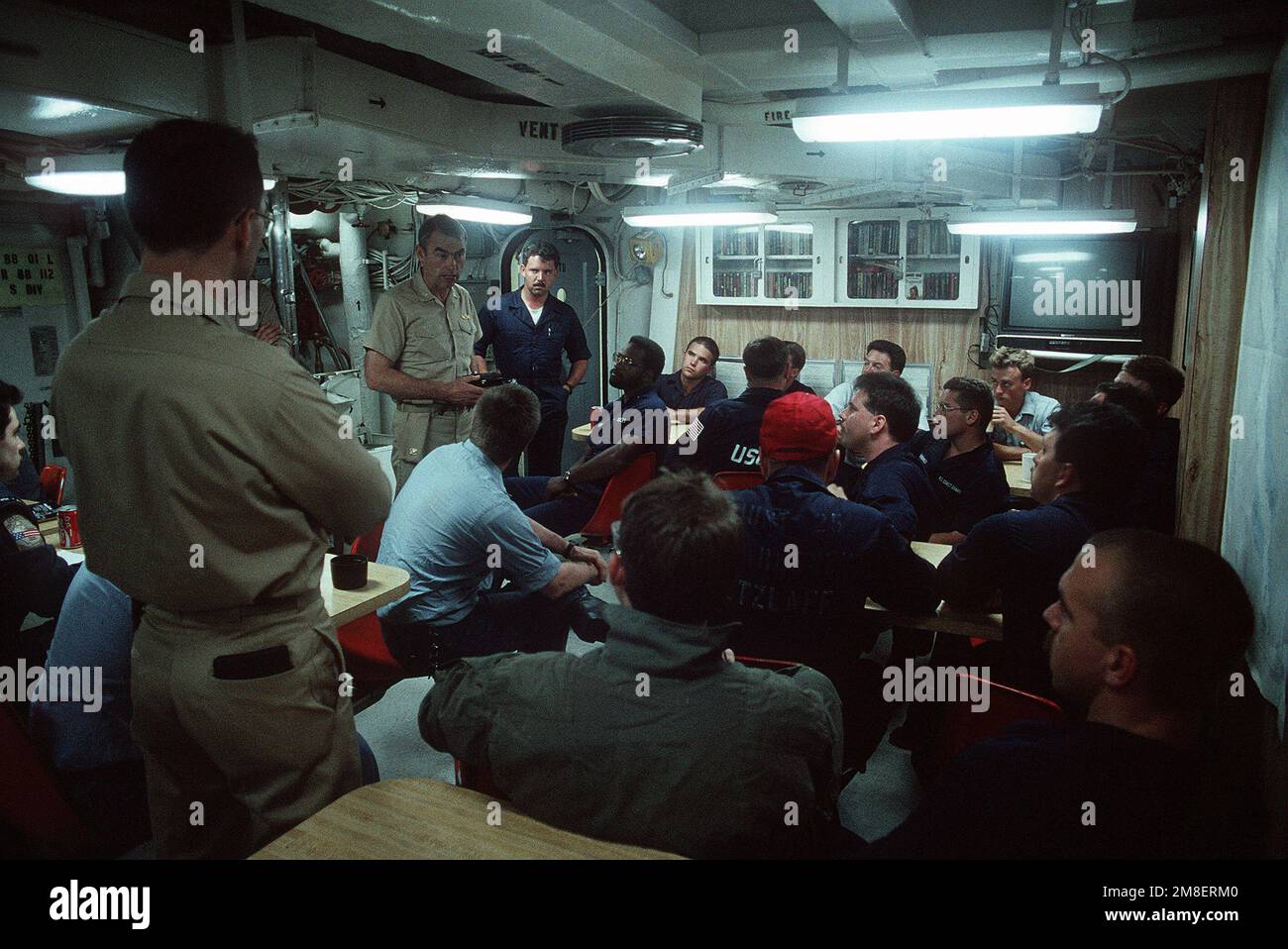 CAPT. Douglas C. Bauer, a Naval historian, questions crew members ...