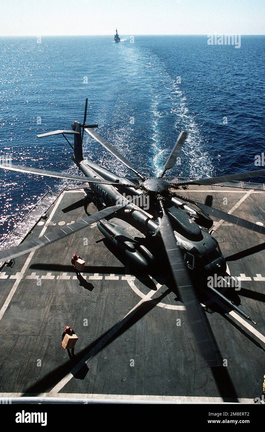 Crew members aboard the Military Sealift Command-operated fleet oiler ...