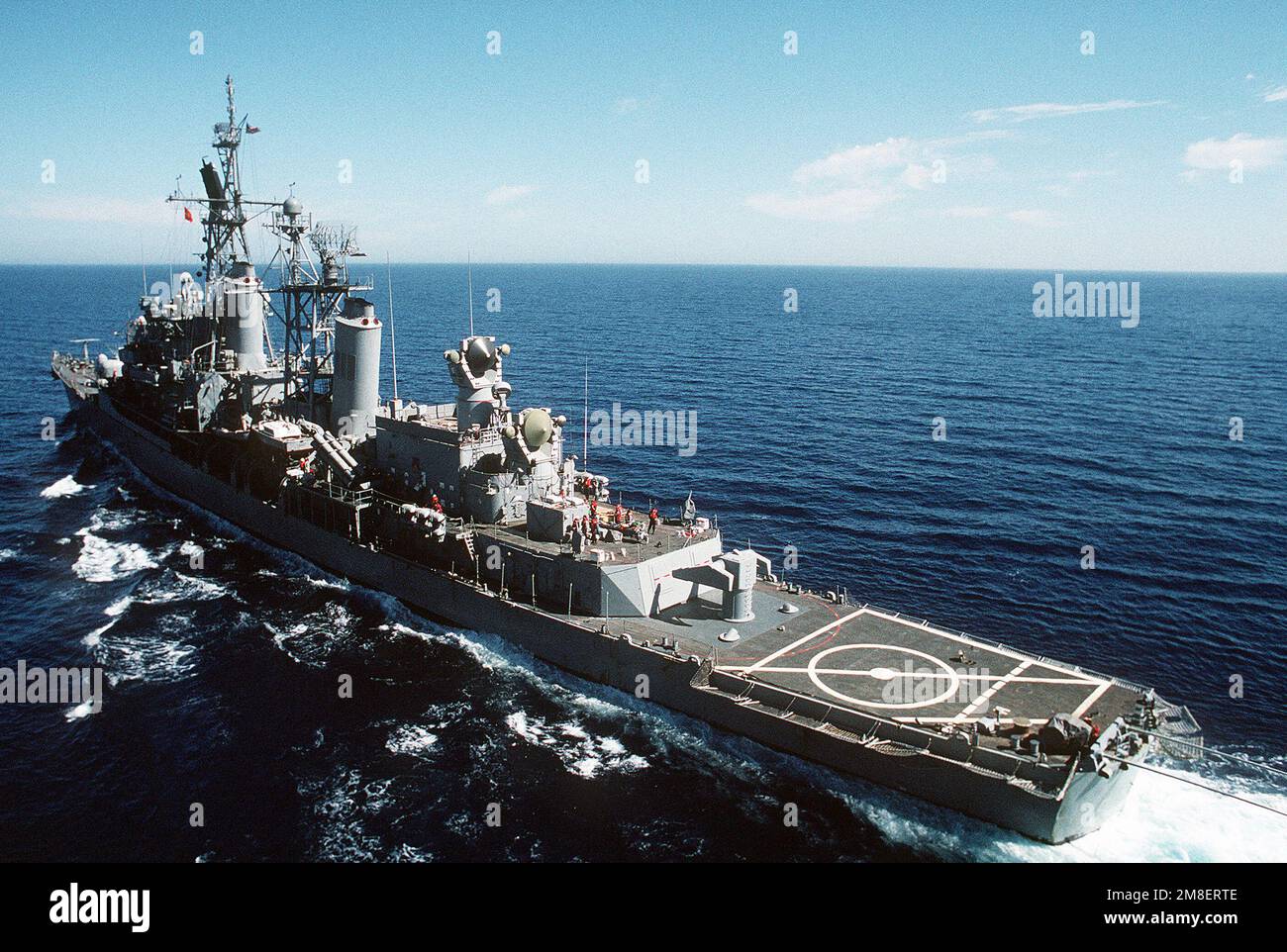 The guided missile destroyer USS WILLIAM V. PRATT (DDG-44) breaks away ...