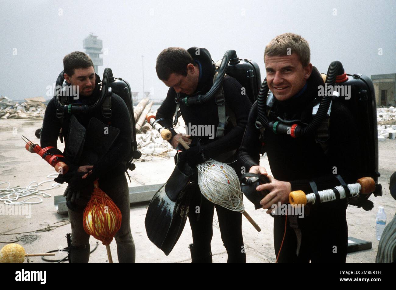 Members of an Australian explosive ordnance disposal (EOD) diving team ...