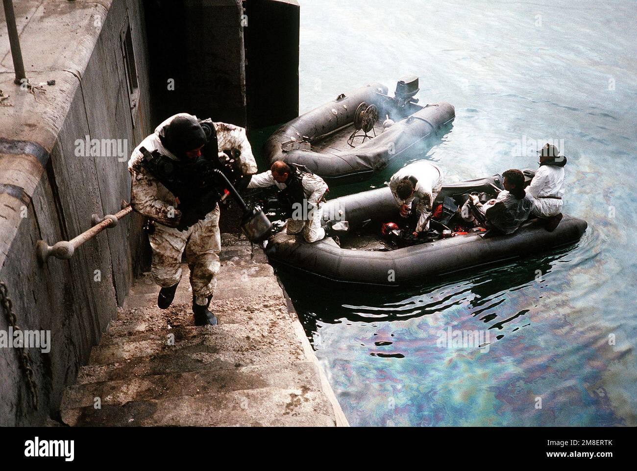 Members of a British explosive ordnance disposal (EOD) team disembark ...