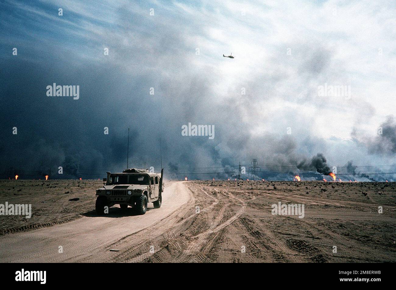 An M998 High-Mobility Multipurpose Wheeled Vehicle (HMMWV) drives along ...