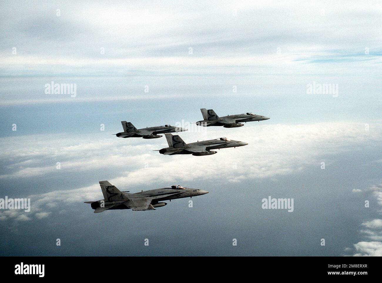 Four Strike Fighter Squadron 137 (VFA-137) F/A-18A Hornet aircraft fly ...